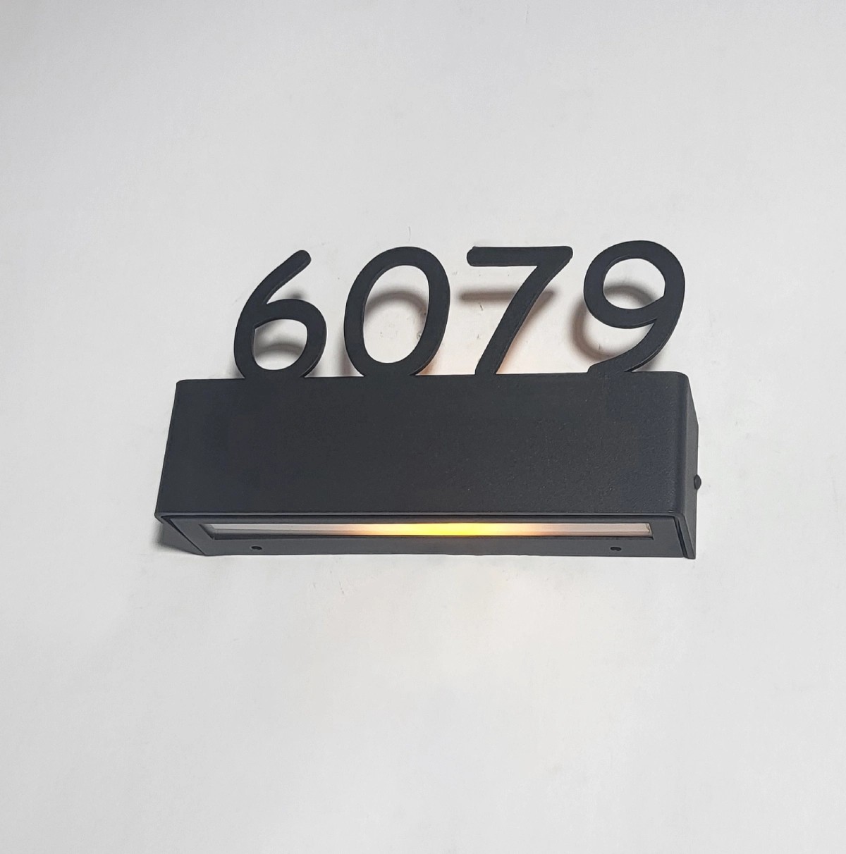 Luminous sign for hotel room numbers, minimalist and customized design.